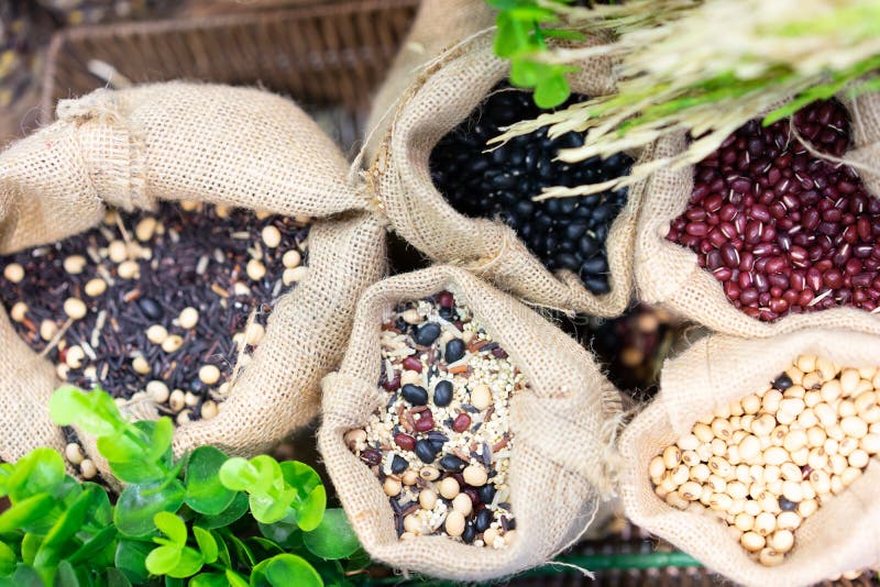 Grains, Beans, Grains and Rice in a Calico Bag on a Wooden Table Stock ...