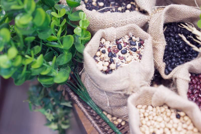 Grains, Beans, Grains and Rice in a Calico Bag on a Wooden Table Stock ...