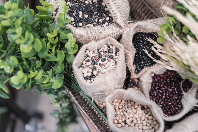 Grains, Beans, Grains and Rice in a Calico Bag on a Wooden Table Stock ...