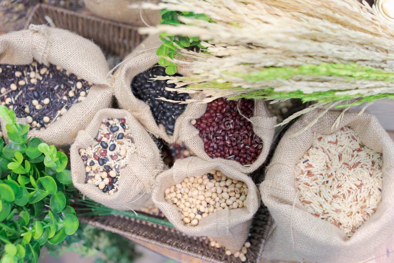 Grains, Beans, Grains and Rice in a Calico Bag on a Wooden Table Stock ...