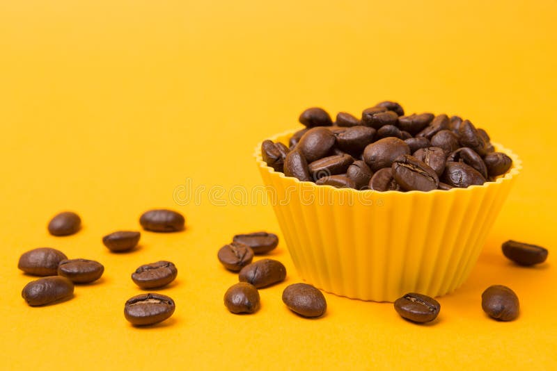 Grains of Coffee in a Yellow Container on a Yellow Background, a Number ...