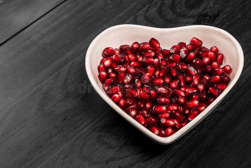 Grains Garnet in Dish on Black Stock Image - Image of plate, food ...