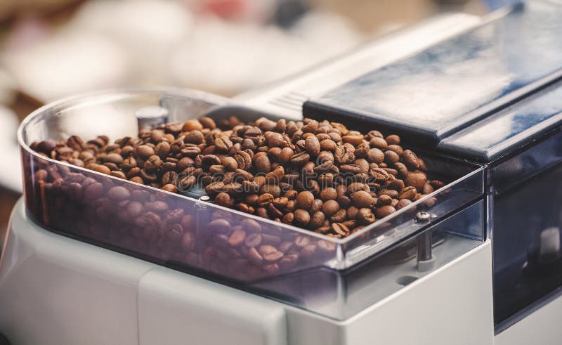 Grains of Roasted Coffee Covered in an Electric Coffee Machine Stock ...
