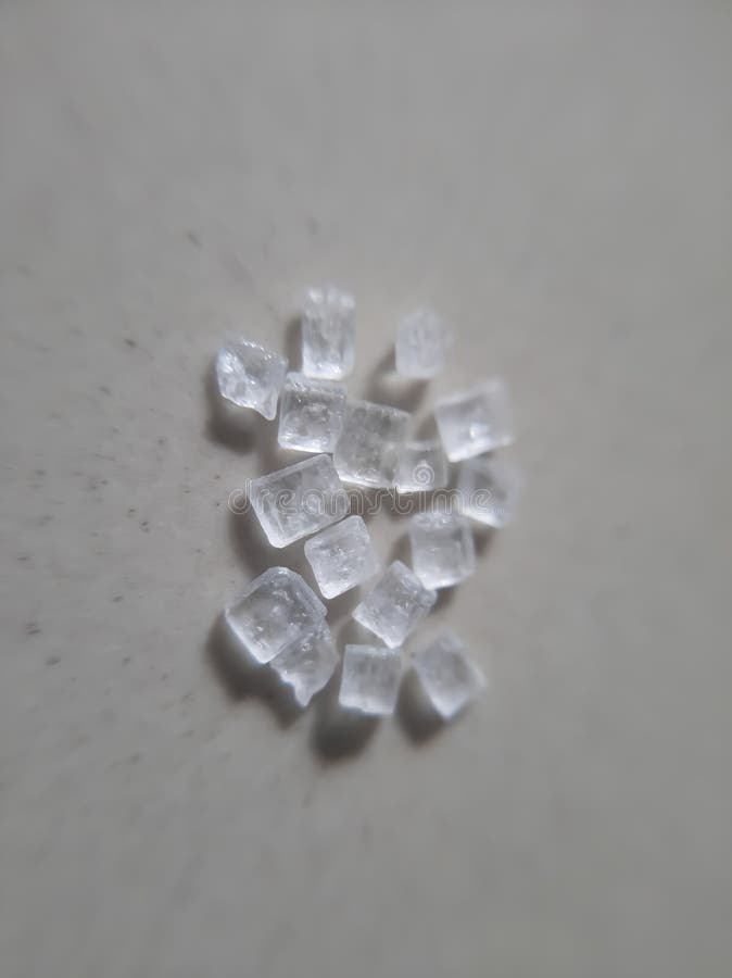 Grains of sugar or sucrose stock photo. Image of enlarged - 13740248