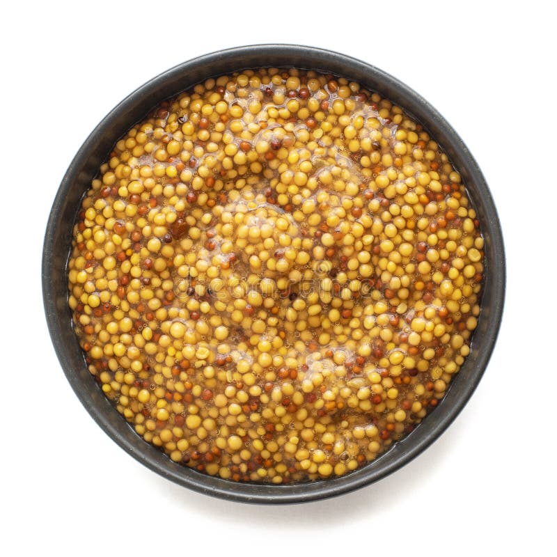 Mustard Grainy Texture in Glass Bowl on Yellow Background Top View ...