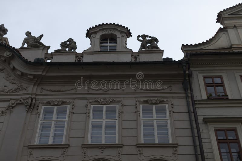 A Grand Building Featuring Numerous Windows and Impressive Statues on ...