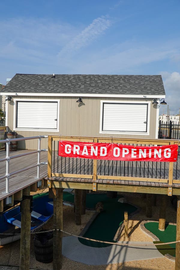Grand Opening Sign in Front of a Shack on a Boardwalk Stock Image ...