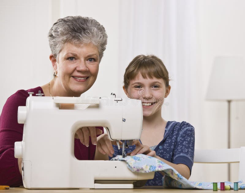 Sewing with Grandma stock photo. Image of isolated, girl - 11227040