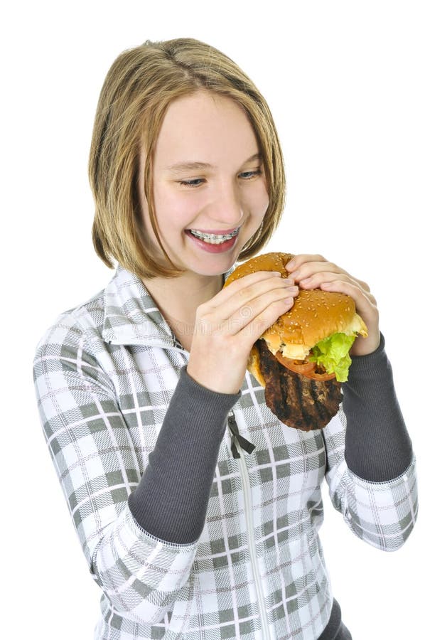 Fille De L'adolescence Heureuse Mangeant Un Hamburger Photo stock ...