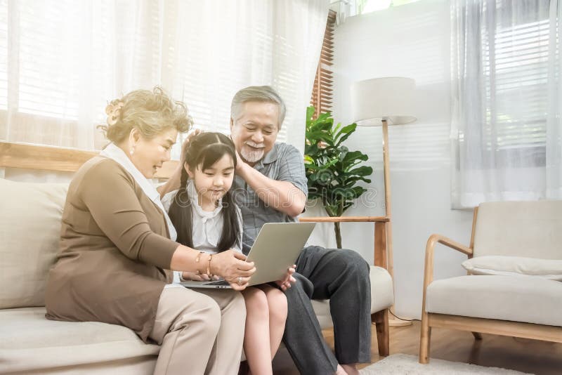 Grandfather and Grandmother Playing Computer with Girl Stock Photo ... Grandfather and Grandmother Playing Computer with Girl Stock Photo ...