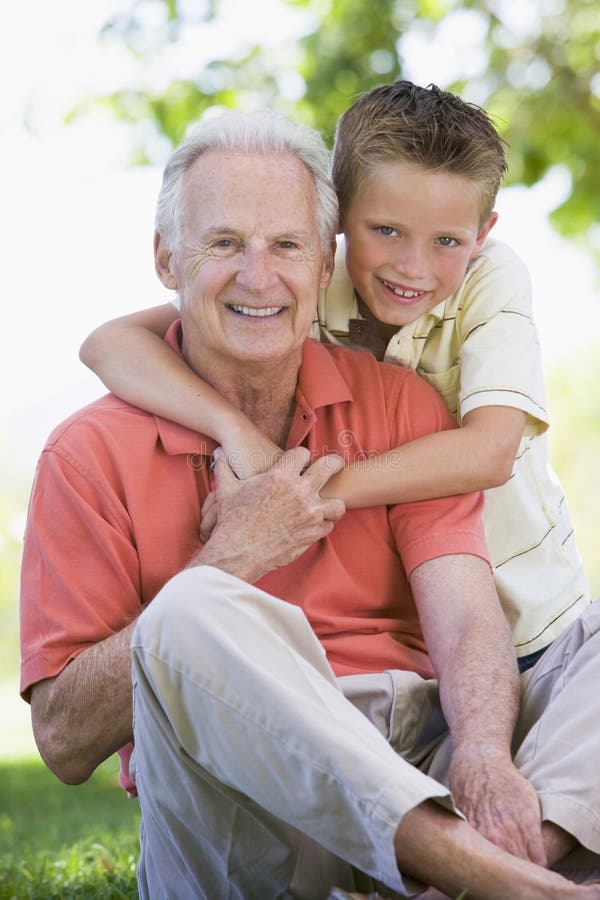 Grandfather and Grandson Smiling Stock Photo - Image of arms, camera ...