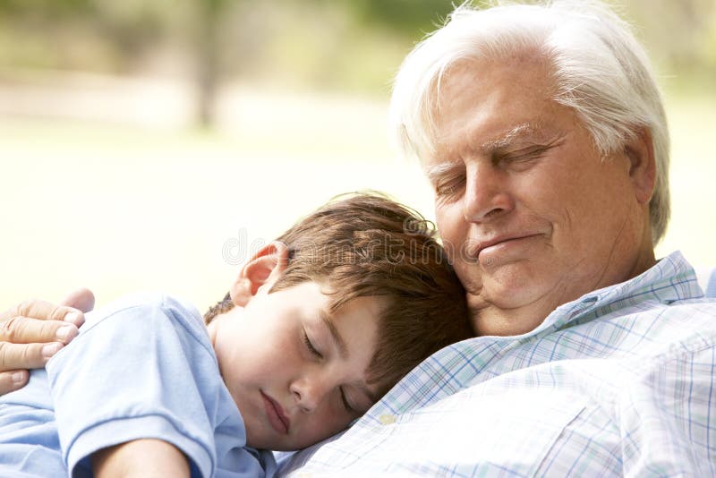 Grandfather Hugging Grandson in Park Stock Image - Image of doze ...