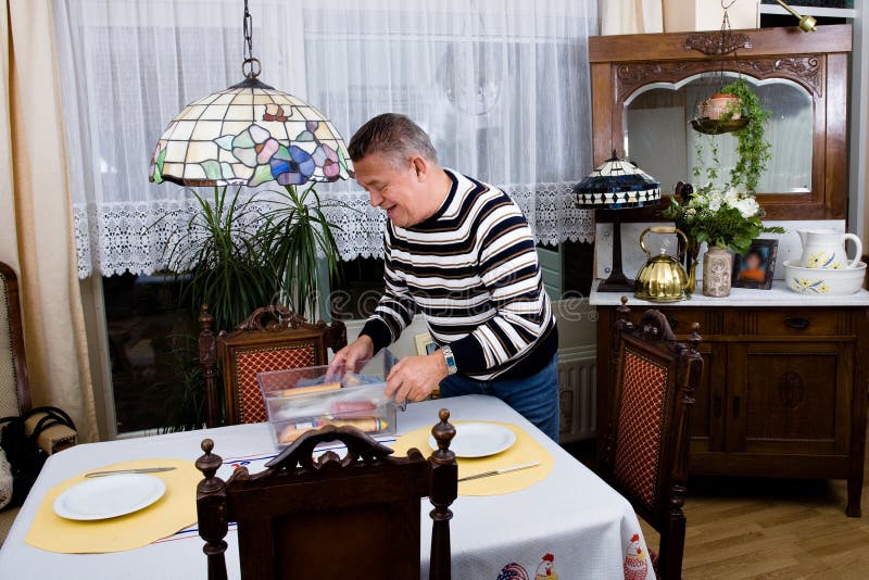 Grandfather is Setting the Table for Breakfast Stock Photo - Image of ...