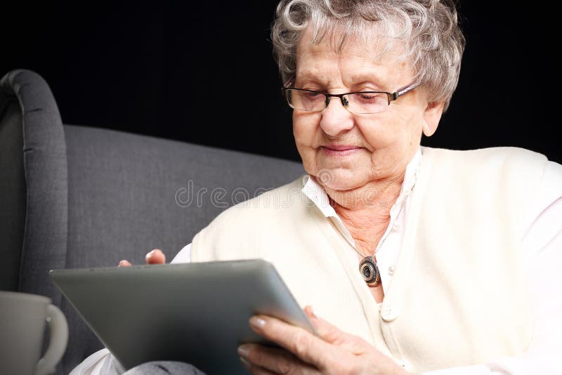 Grandma and the computer. stock photo. Image of looks - 70180256