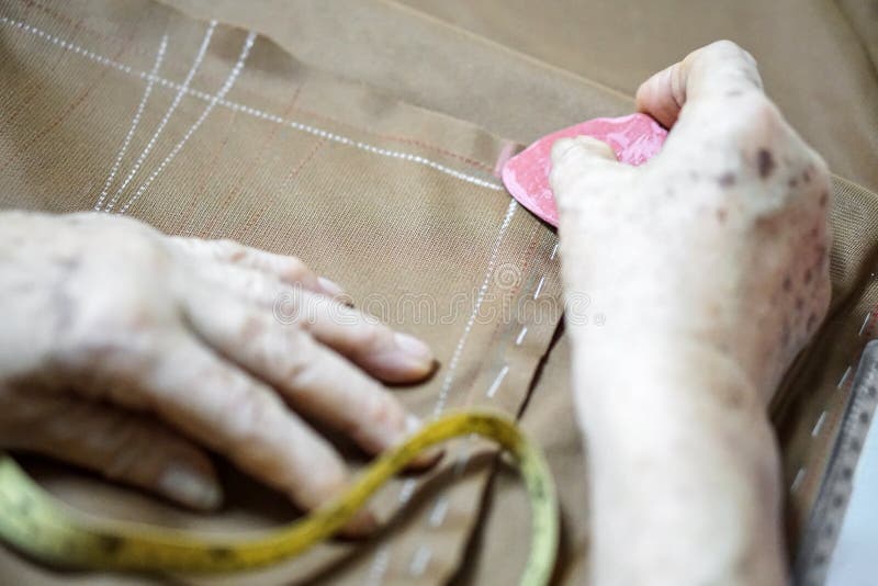 Grandma Hand Drawing Marking Line for Sewing Cloth Stock Photo - Image ...