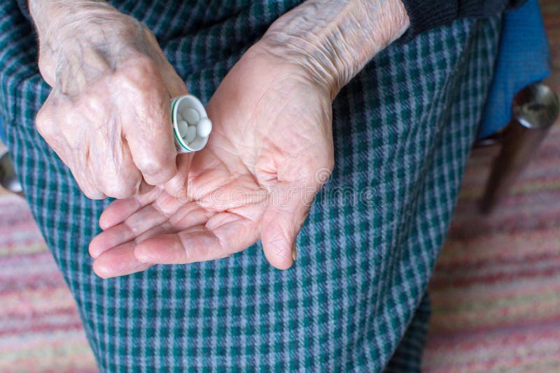 Grandma taking pills stock photo. Image of holding, medical - 69224018