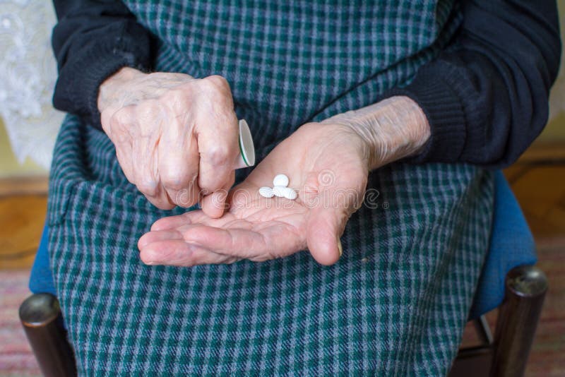 Grandma taking pills stock photo. Image of senior, healthcare - 70288946