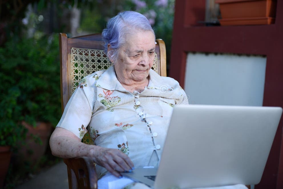 Grandma using a laptop stock image. Image of computer - 69121971