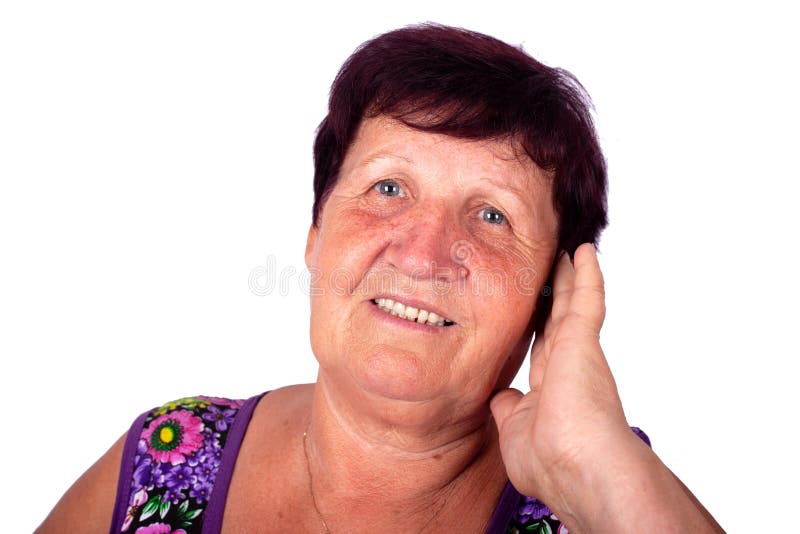 61 Year Old Grandmother With An Amused Face Listens To An Entertaining