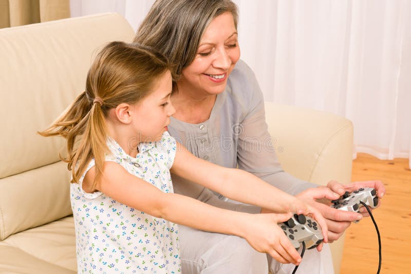 Grandmother and Granddaughter Play Computer Game Stock Photo - Image of ...