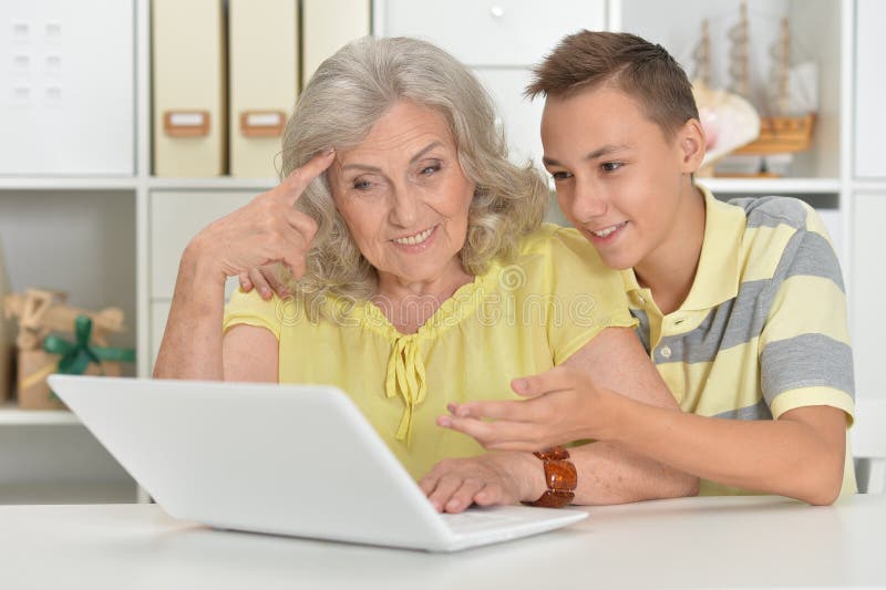 Grandmother with Grandson Using Laptop at Home Stock Image - Image of ...