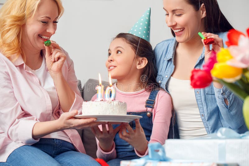 Grandmother Mother And Daughter Together At Home Celebration Sitting