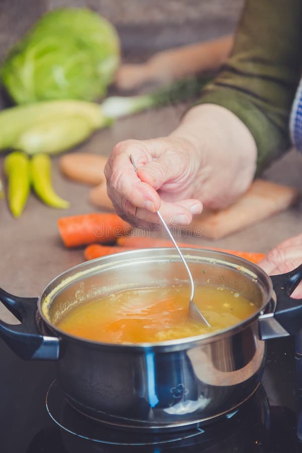 Grandmother steering soup stock photo. Image of food - 54814710