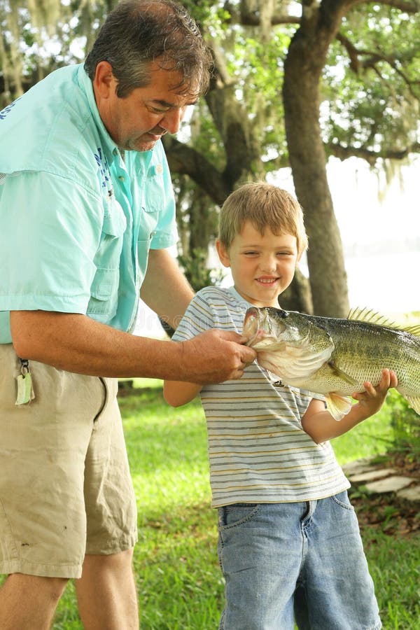 Fishing with Grandpa stock image. Image of blue, childhood - 4123505