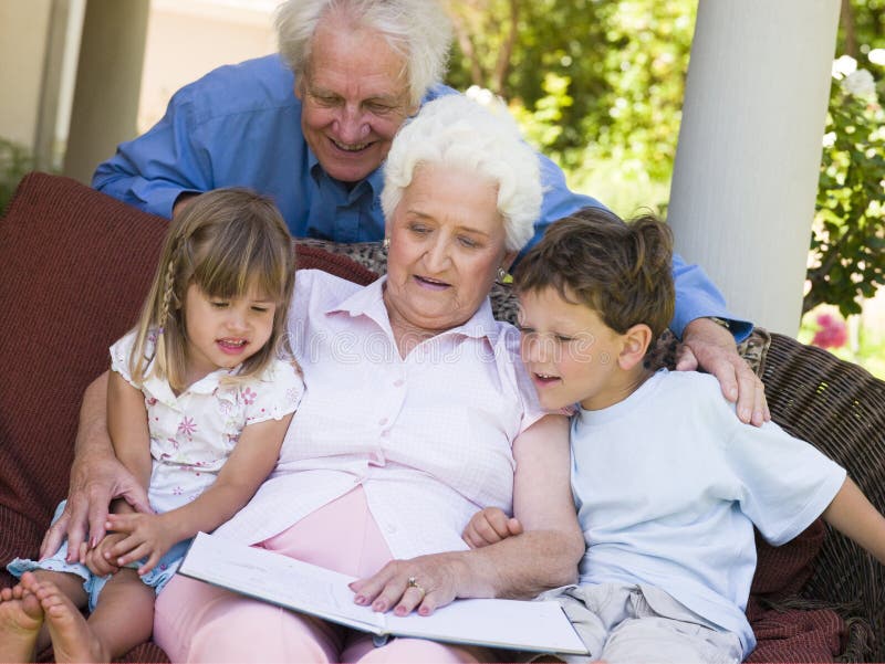 Grandparents Reading To Grandchildren Stock Photo - Image of read ...