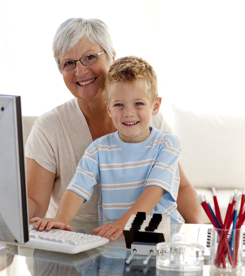 Grandson Using a Computer with His Grandmother Stock Image - Image of ...