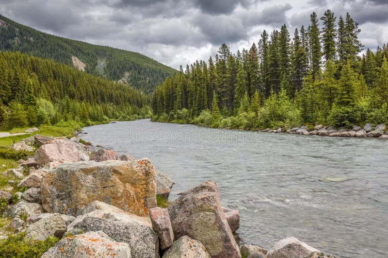 Granite Boulders Lining a Mountain River - Alberta, Canada Stock Photo ...