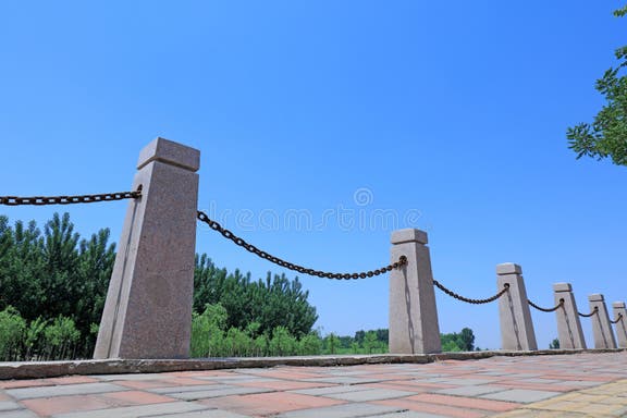 Granite pillars and chains stock photo. Image of chain - 369383276