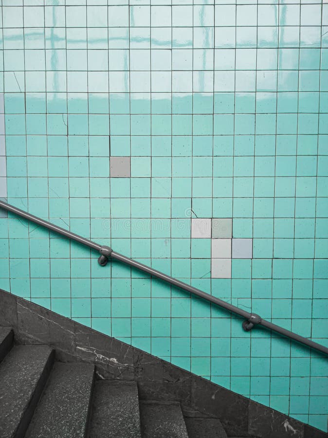 Granite Stairs on the Background of a Wall of Turquoise Square Glossy ...