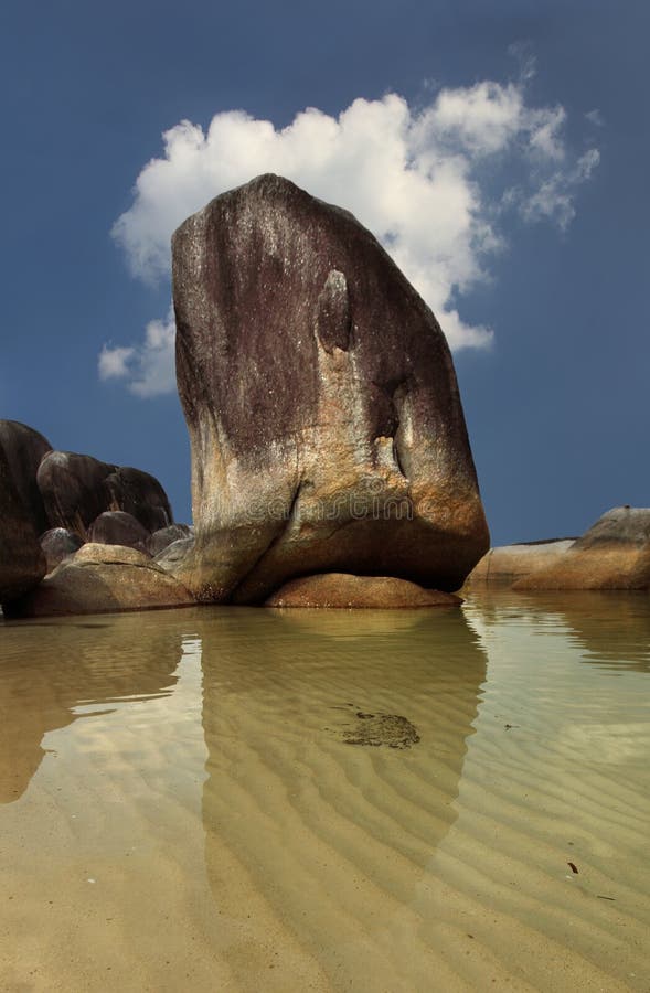 Granite stone on beach stock photo. Image of sunny, ocean - 21225890