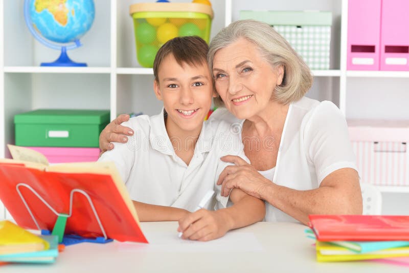 Granny with Her Grandson Doing Homework at Home Stock Image - Image of tech, elder: 226629699