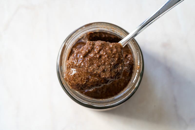 Granola Butter Spread on Bread or Ready To Eat with Spoon in Jar Stock ...