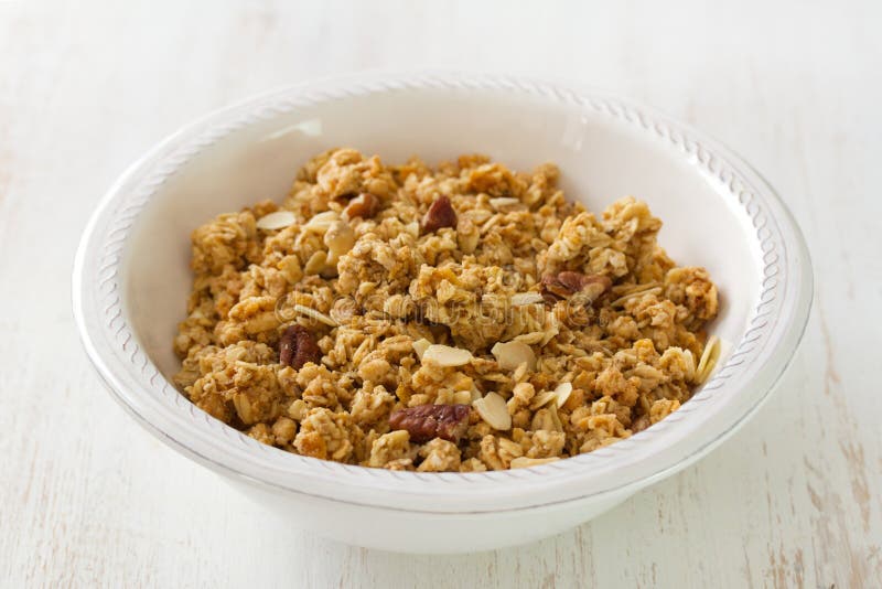 Granola in White Bowl on White Background Stock Photo - Image of grains ...