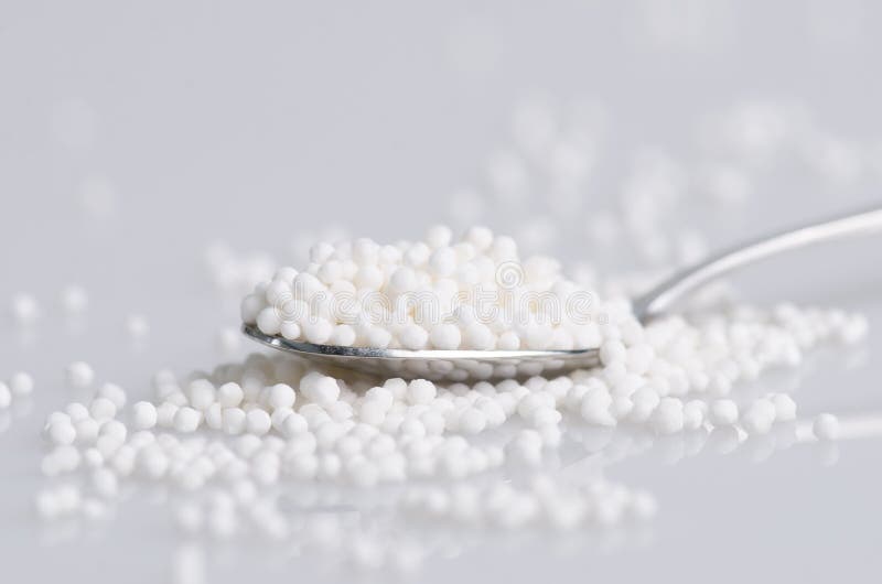 Granulated Cassava Tapioca in Steel Spoon Isolated on White Ba Stock ...