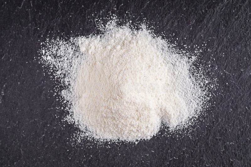 Granulated Milk Powder on a Dark Stone Background Stock Image - Image ...