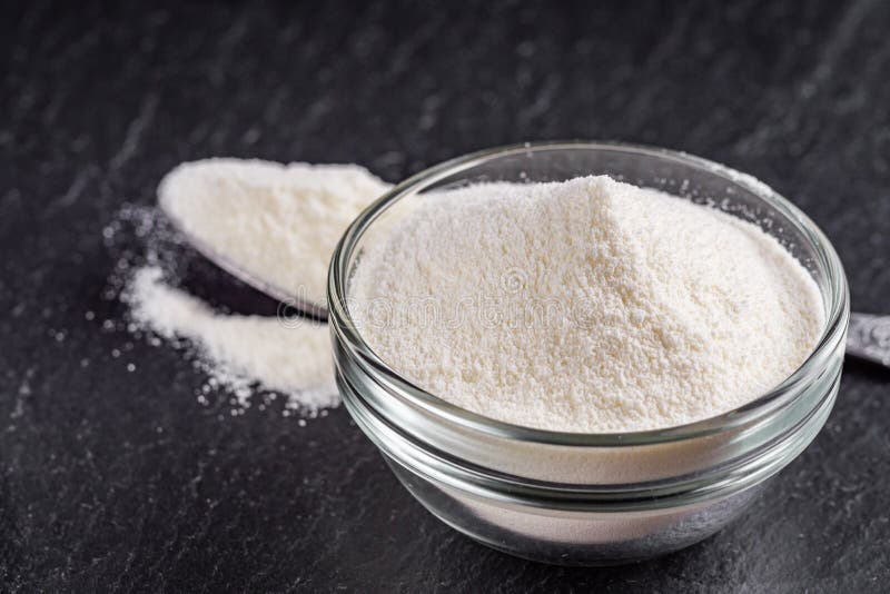 Granulated Milk Powder on a Dark Stone Background Stock Image - Image ...