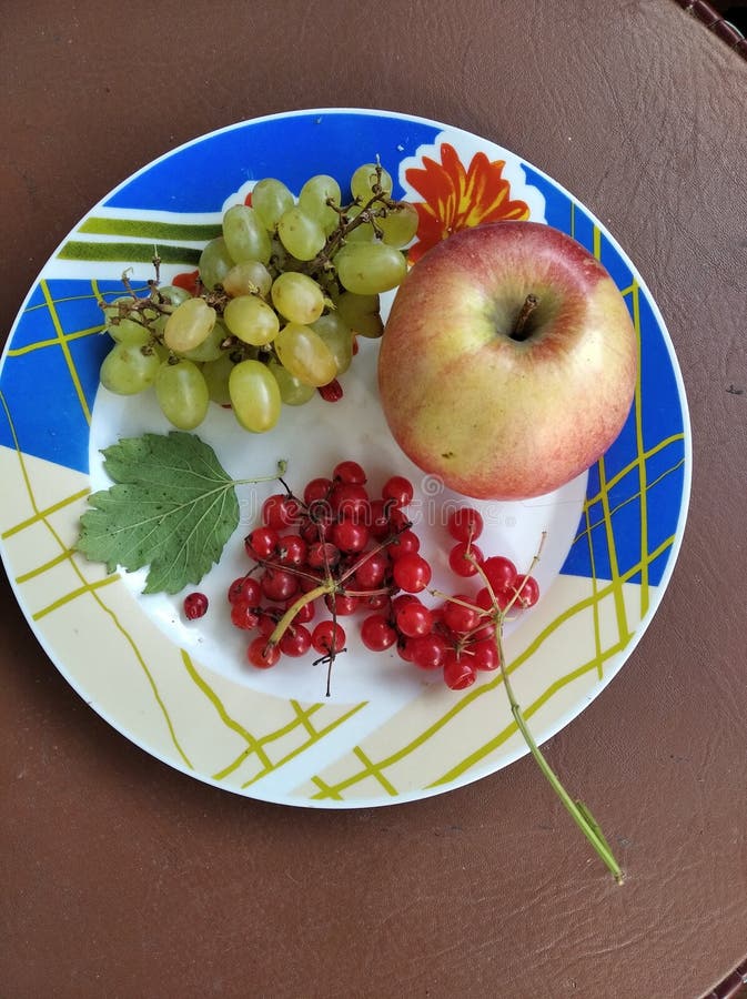 Grape, Apple, Snowball Berries and Leaf on the Saucer Stock Photo ...