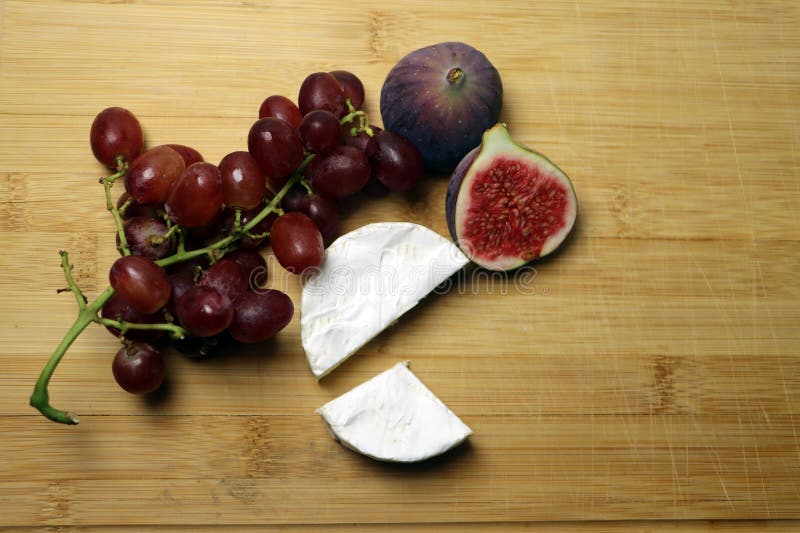 Grape, Fig, Cheese on Kitchen Breadboard Stock Image - Image of snack ...