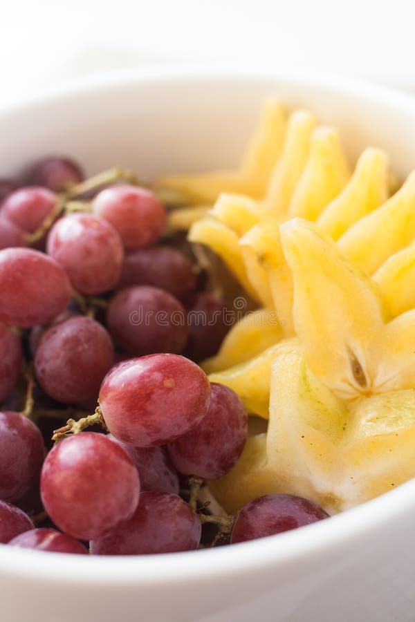 Grape and Starfruit in a Bowl Stock Photo - Image of starfruit, stars ...