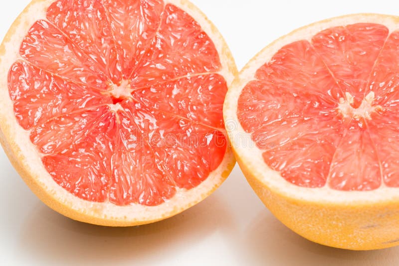 Grapefruit halves stock photo. Image of symmetry, pair - 77932208