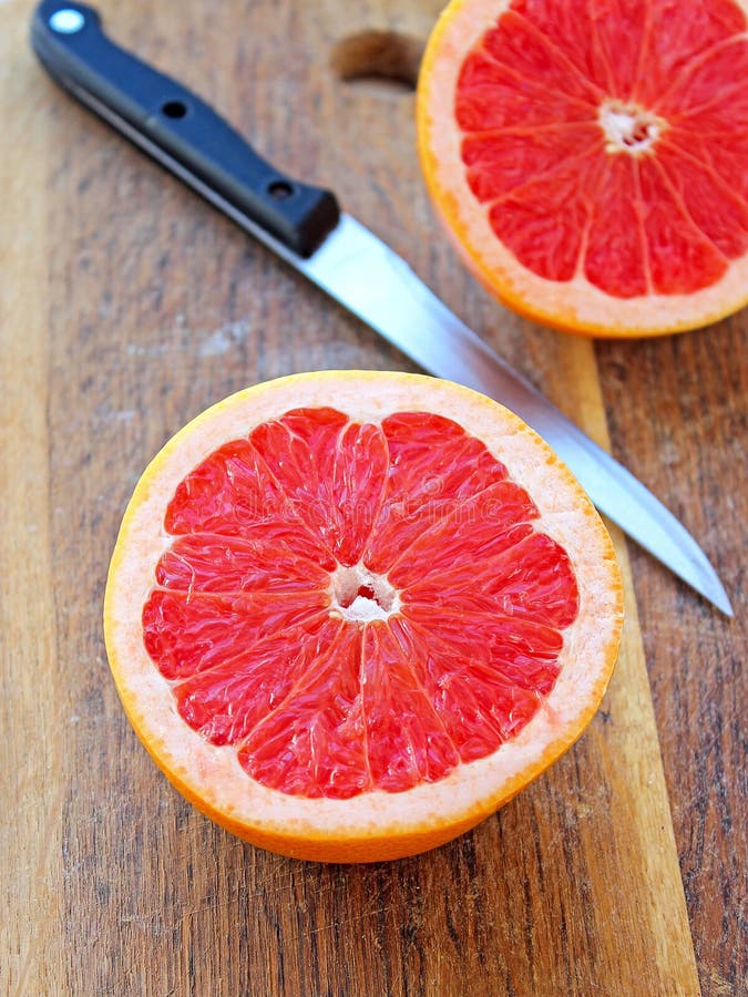 Grapefruit Halves on Wooden Plank Stock Photo - Image of pulp, fresh ...