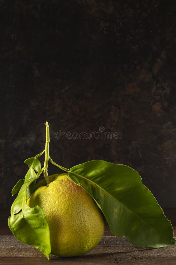 Grapefruit with Leaves on a Wooden Table Stock Image - Image of ...