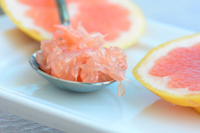 Grapefruit pulp on a spoon stock image. Image of grapefruit - 111715225
