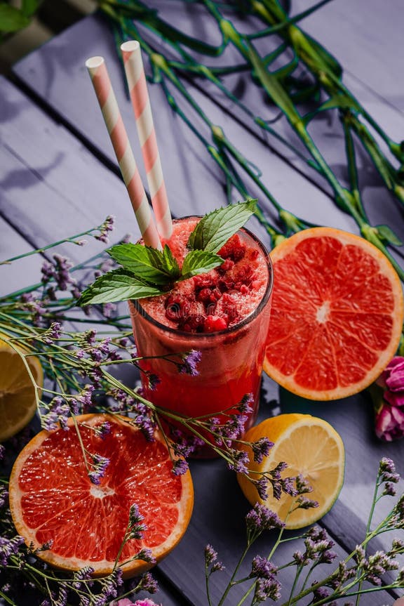 Grapefruit, Raspberry Shrub, Lemonade, and Mint Leaves Sit Stock Photo ...