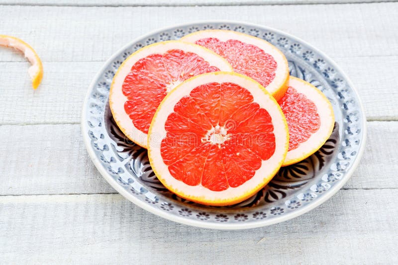 Grapefruit Slices on a Plate Stock Image - Image of juicy, slice: 37796235