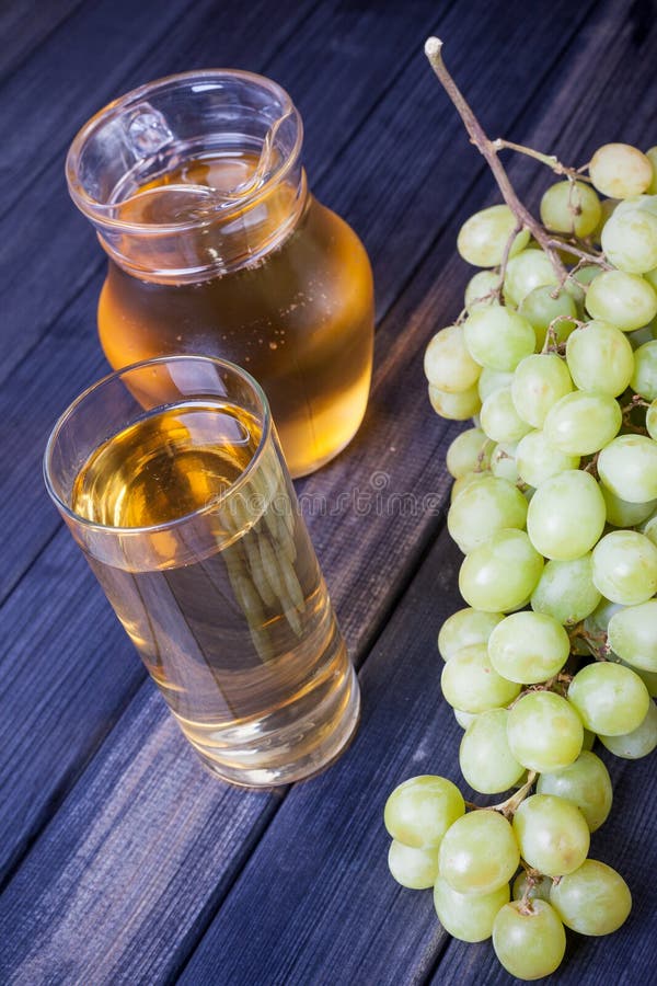 Grapes Bunch and a Pitcher of Grape Juice Stock Image - Image of black ...